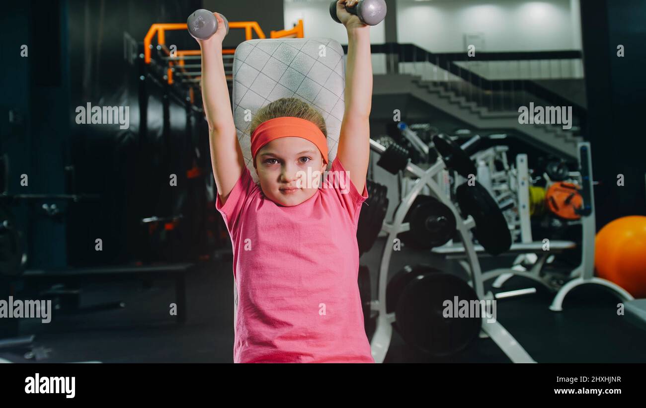 Fit Athletic Baby Girl Work out with Dumbbell, Doing Her Fitness ...