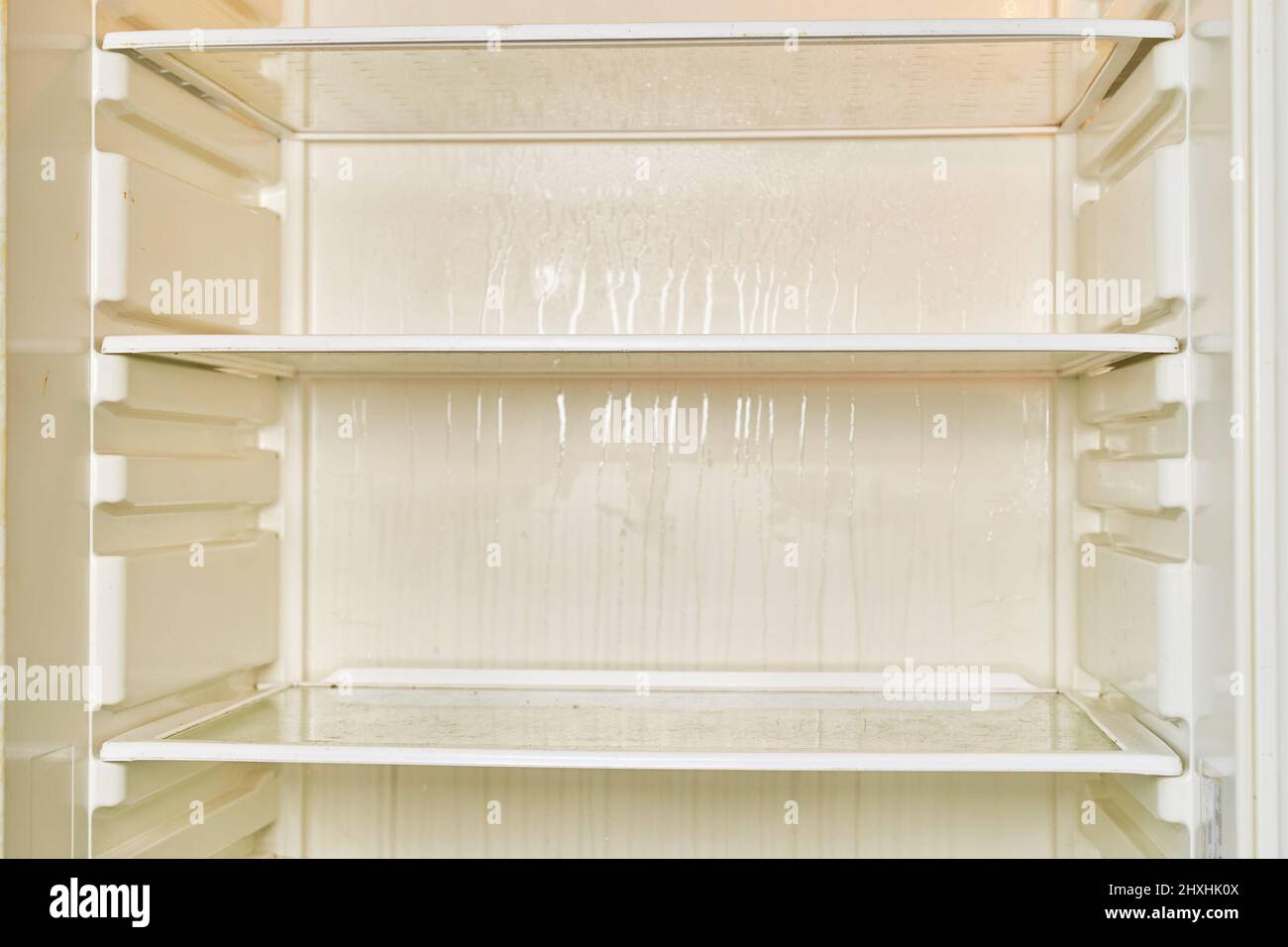 Empty refrigerator shelves. Lack of food, hunger Stock Photo - Alamy