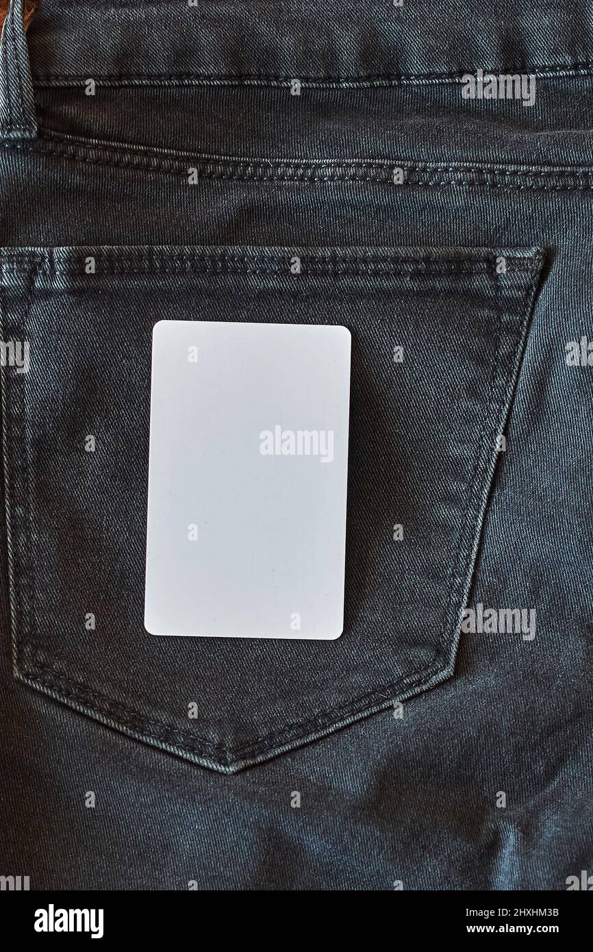 The upper part of old worn black jeans with pockets and a white tag for ...