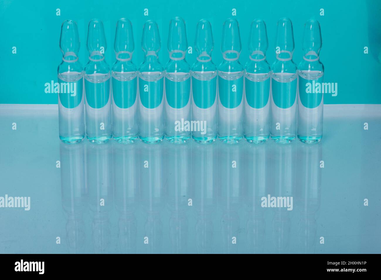 Glass medical ampoule vial for injection. Medicine is liquid sodium ...