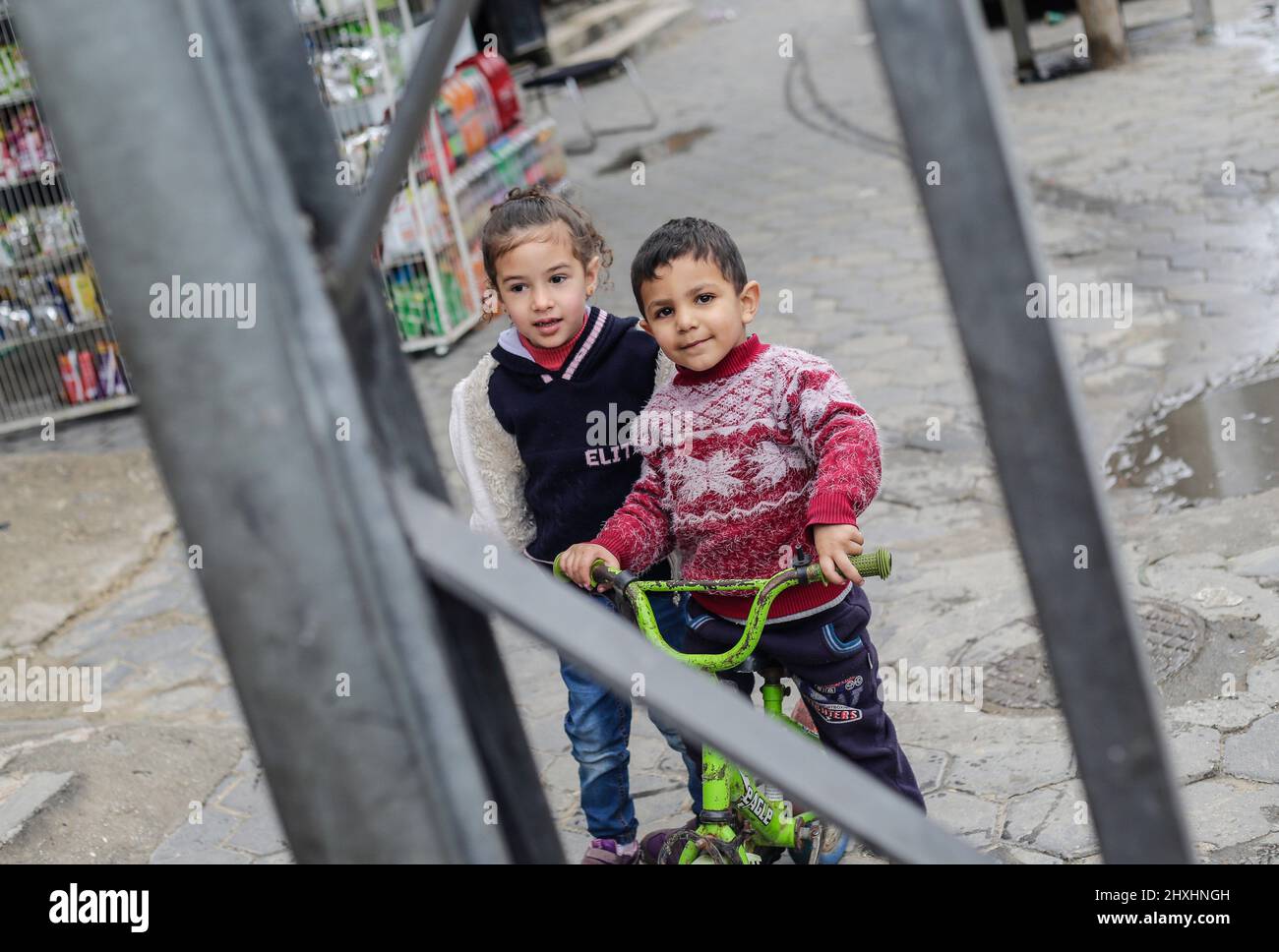 Palestinian children playing in front of their house in the northern ...