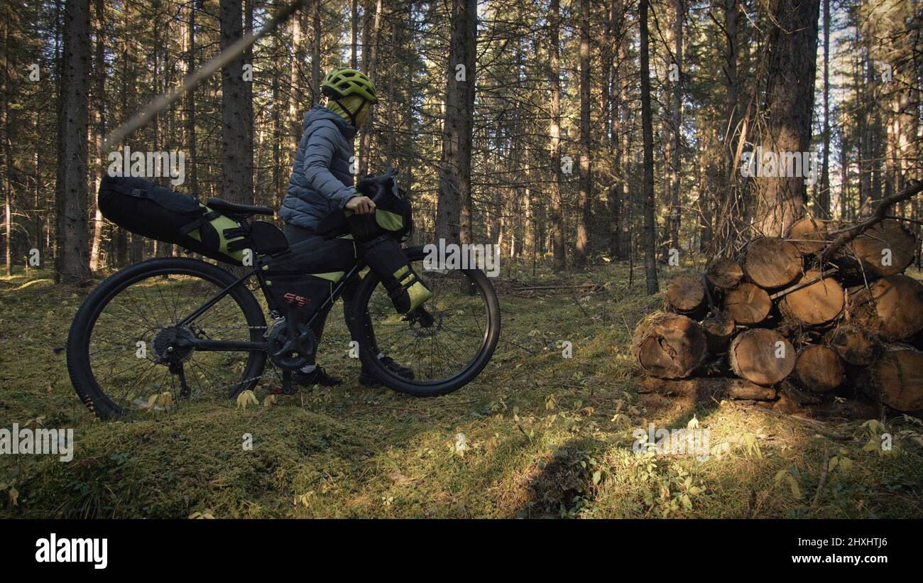 The woman travel on mixed terrain cycle touring with bike bikepacking ...