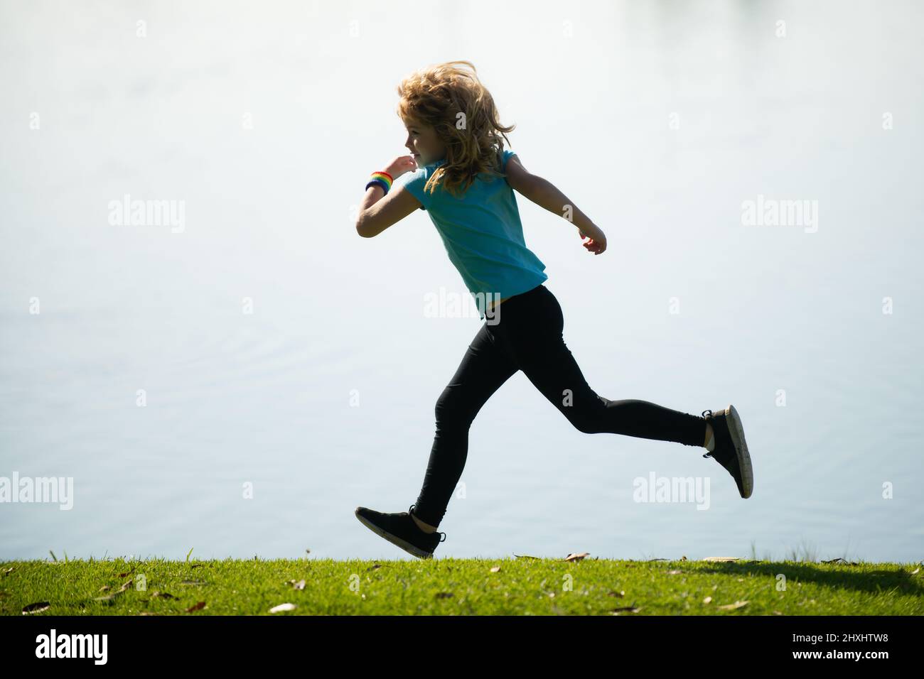 Child boy jogging in park outdoor. Kids sport, happy active kids ...