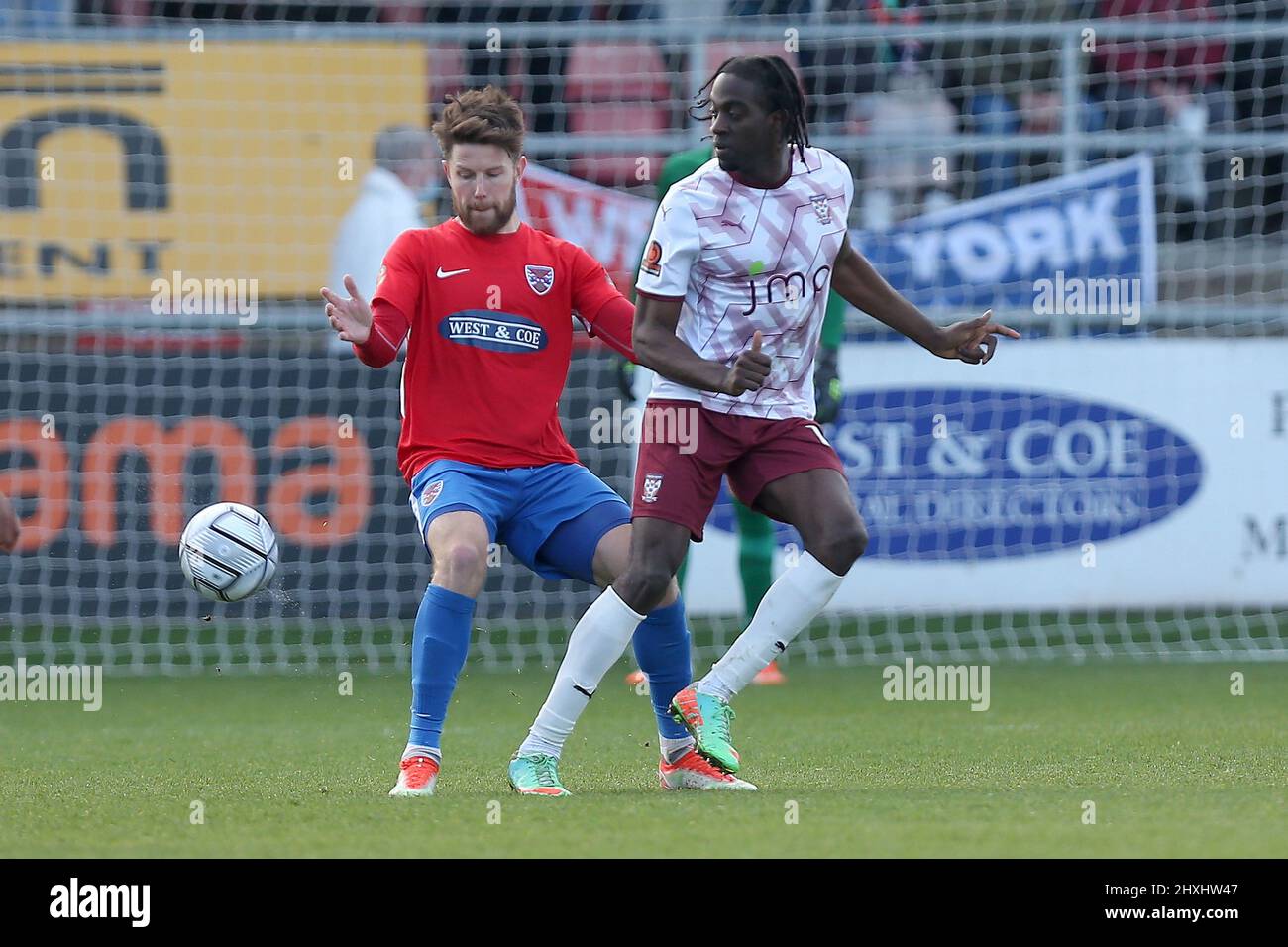 Clayton Donaldson of York and Callum Reynolds of Dagenham and Redbridge ...