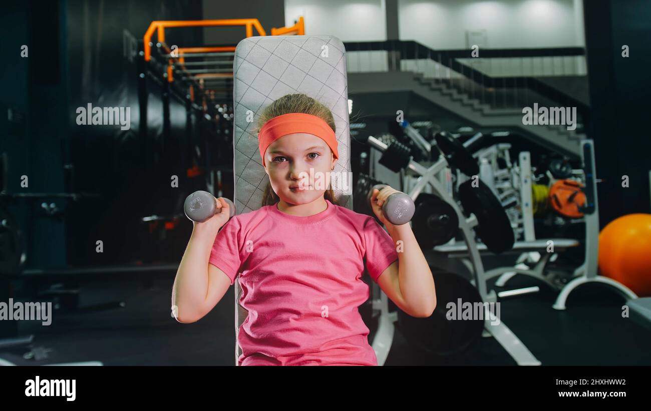 Fit Athletic Baby Girl Work out with Dumbbell, Doing Her Fitness ...