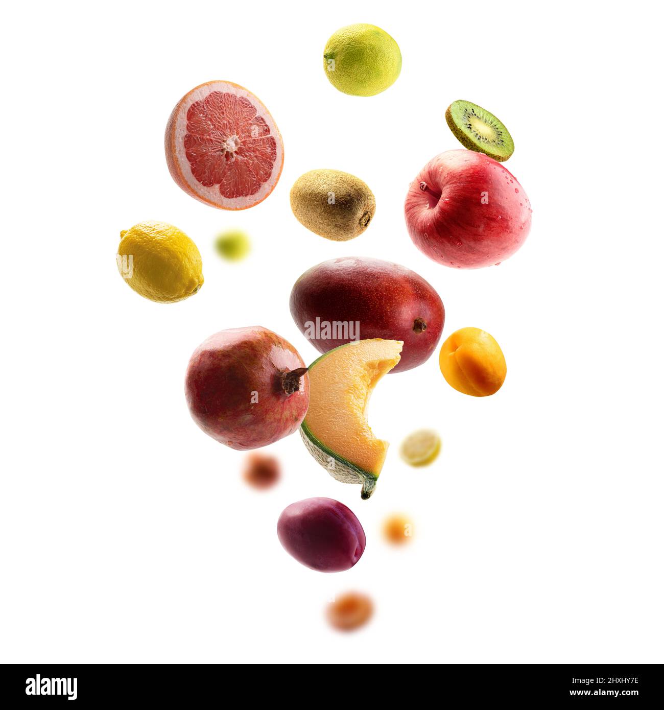 Fresh fruits levitate on a white background Stock Photo - Alamy