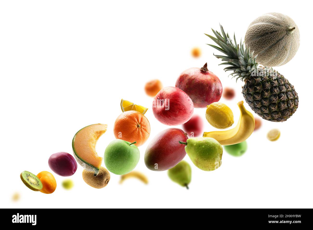 Fresh fruits levitate on a white background Stock Photo - Alamy