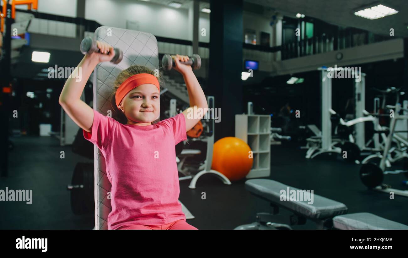Fit Athletic Baby Girl Work out with Dumbbell, Doing Her Fitness ...