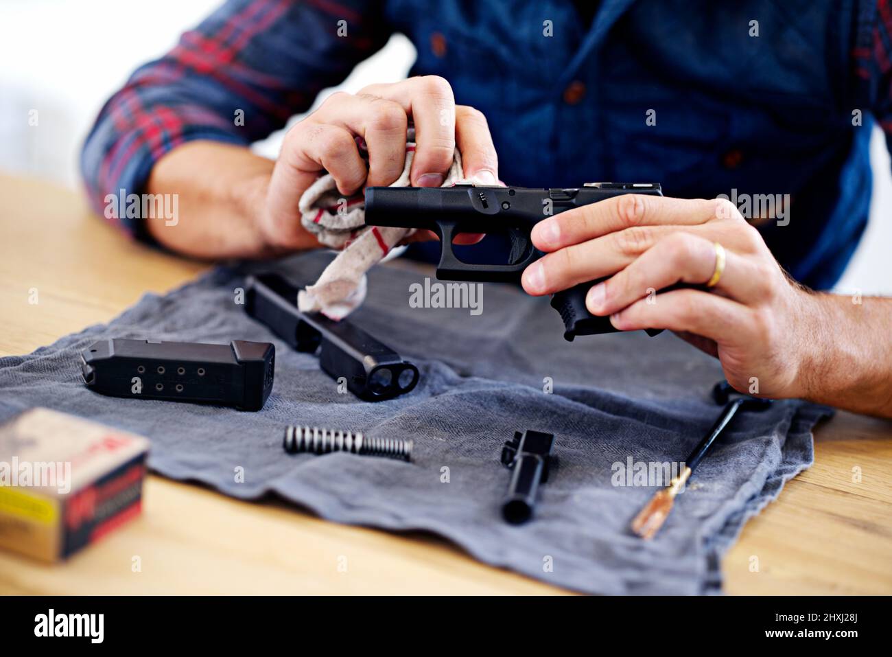 Regular maintenance is essential for every gun owner. Cropped view of a ...