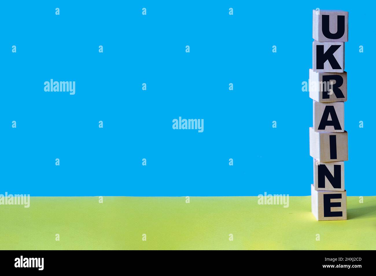 Ukraine, word in wooden alphabet letters isolated on blue and yellow ...