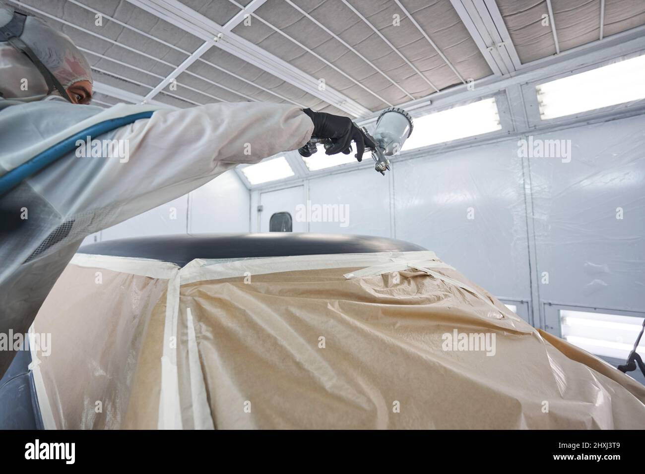 Car painter work process in workshop during painting Stock Photo - Alamy