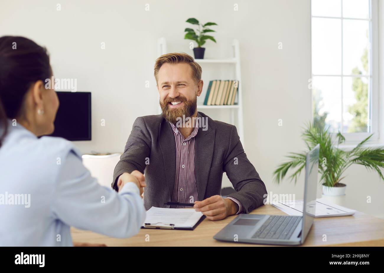 Job interview man woman young handshake hi-res stock photography and ...