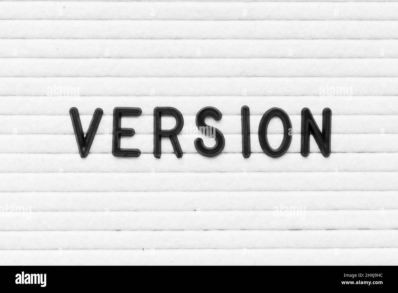 Black color letter in word version on white felt board background Stock ...