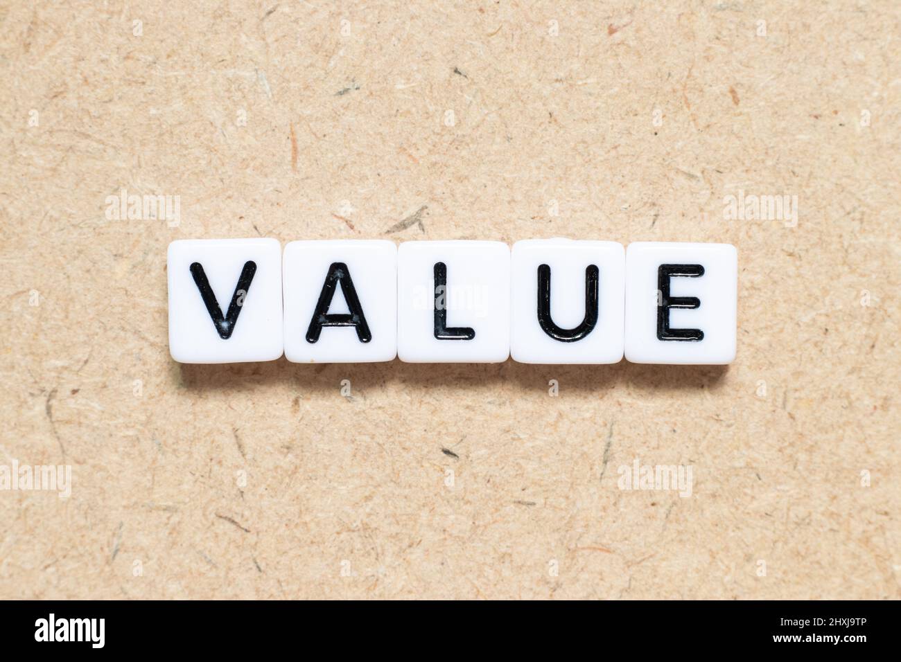 White tile alphabet letter with word value on wood background Stock ...