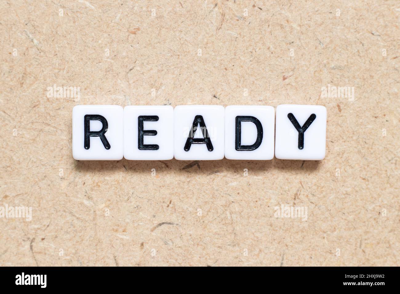 White tile alphabet letter with word ready on wood background Stock ...