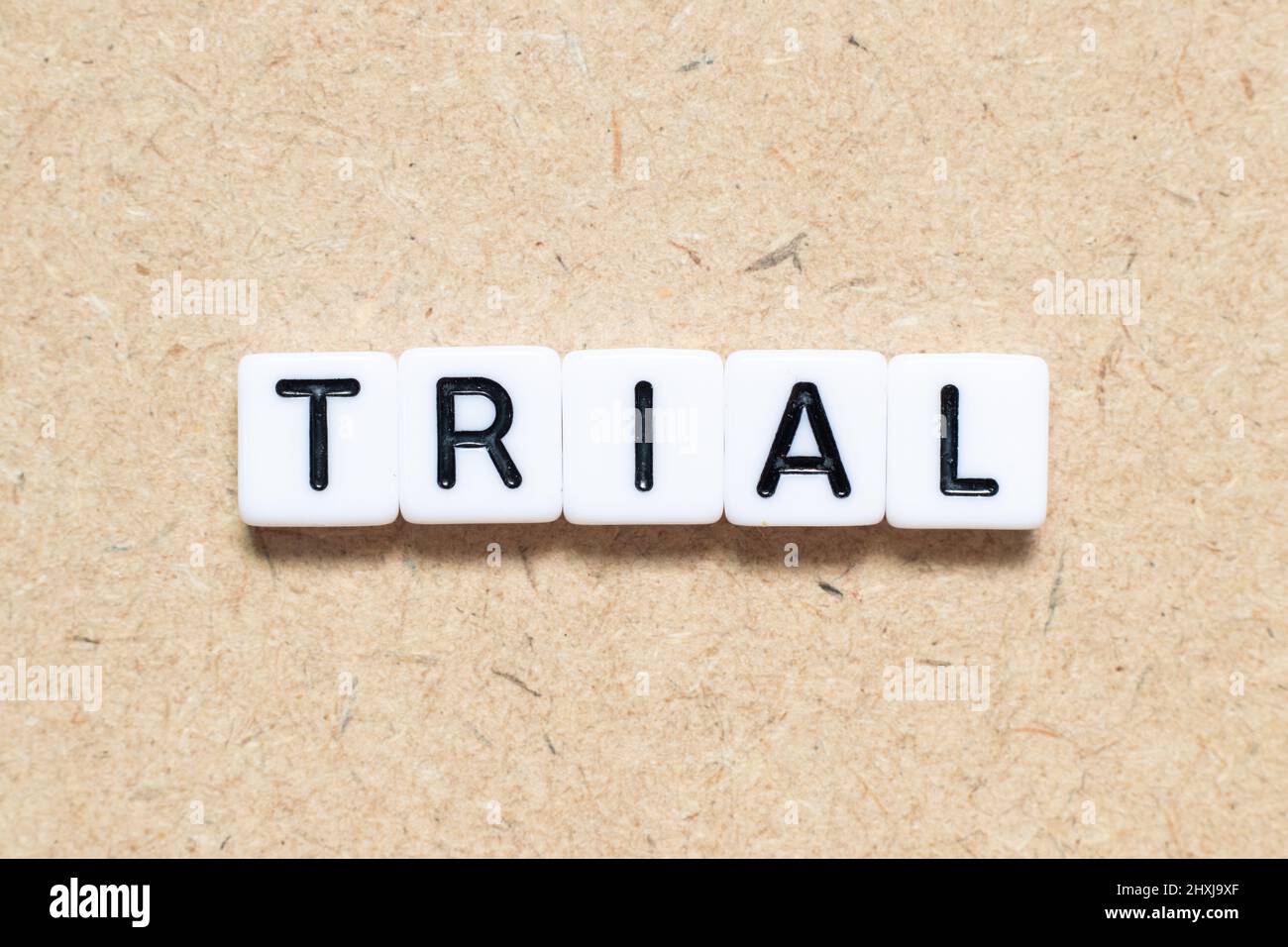 White tile alphabet letter with word trial on wood background Stock ...