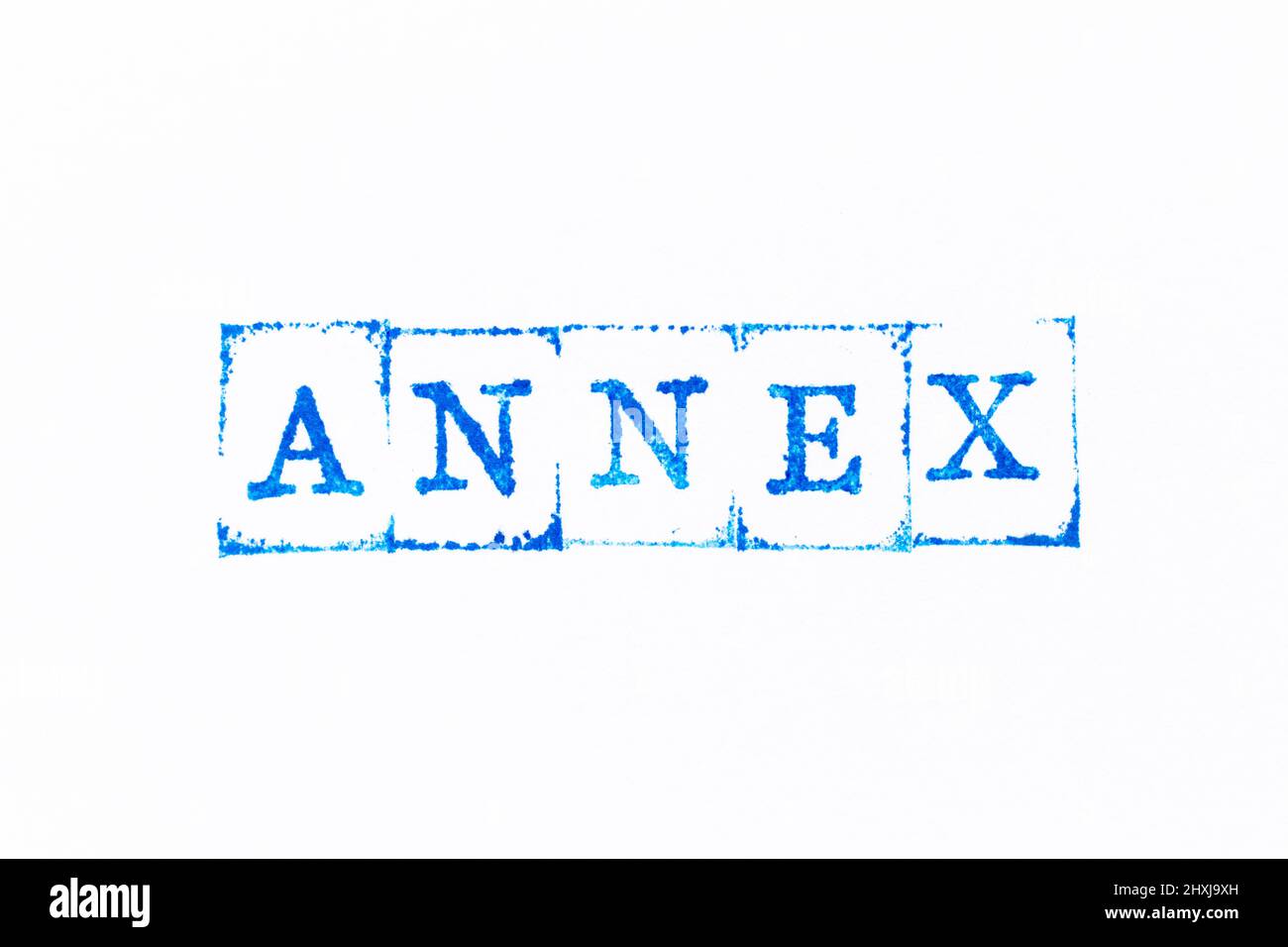 Blue color ink rubber stamp in word annex on white paper background ...