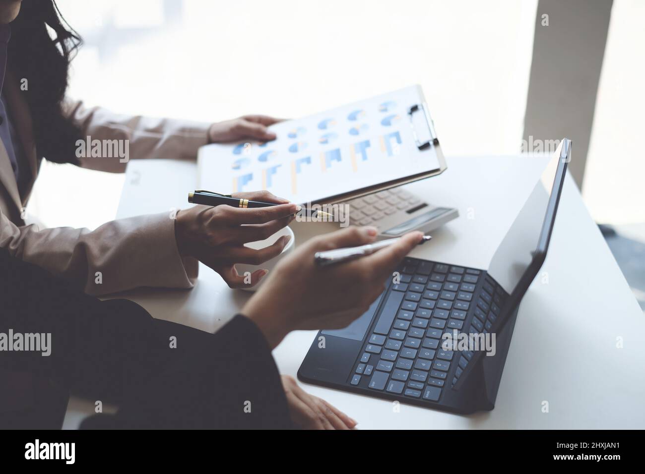 At the office desk, a company team is organizing a successful team ...