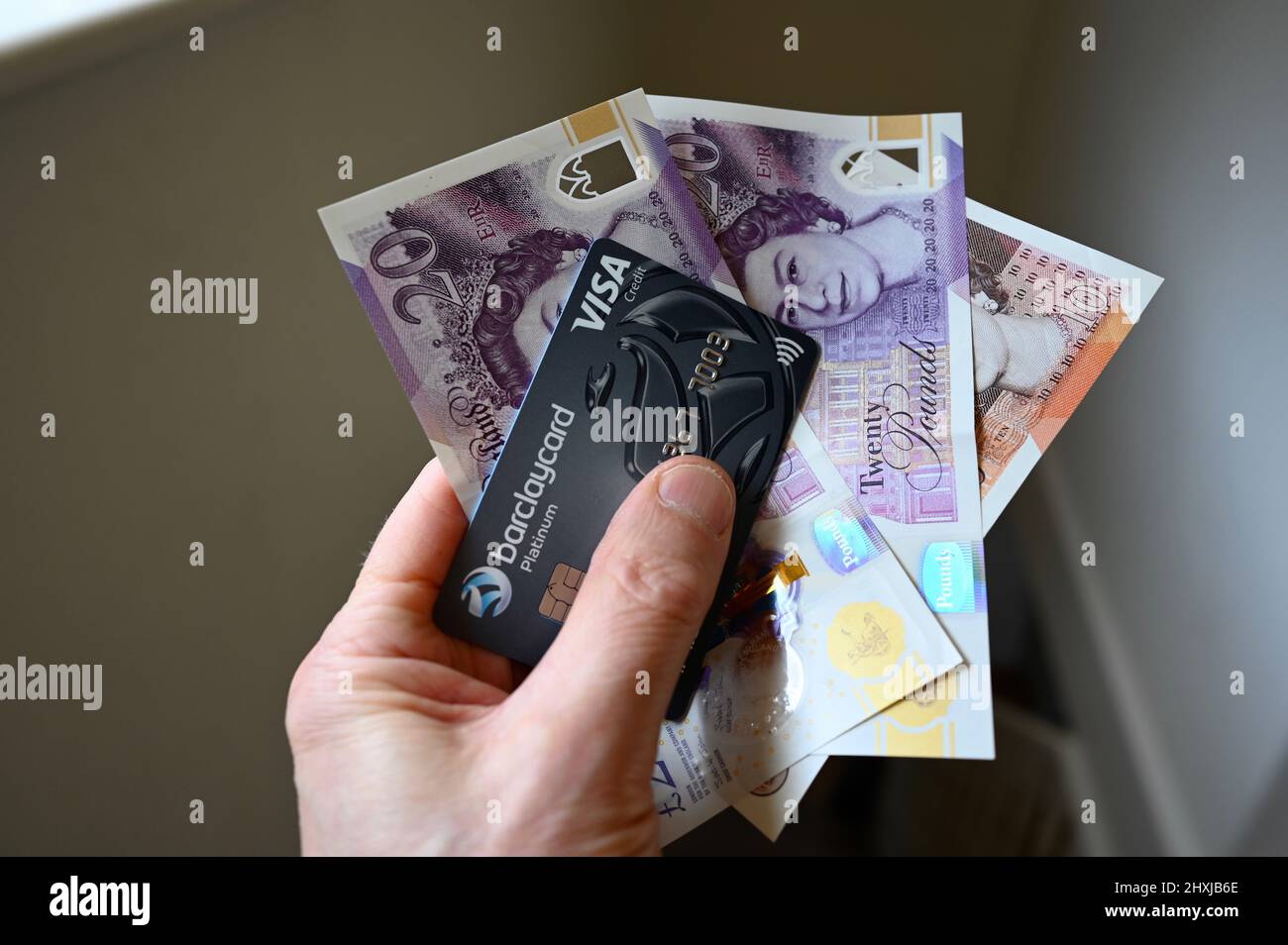 Close-up of a Barclaycard Visa card and various pound notes Stock Photo ...