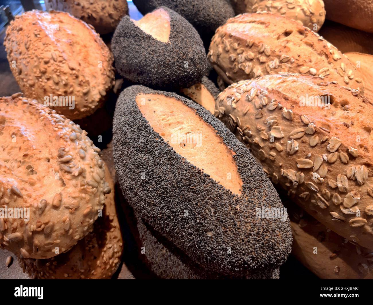Bread rolls in a bakery display as a symbol for diversity in the range ...