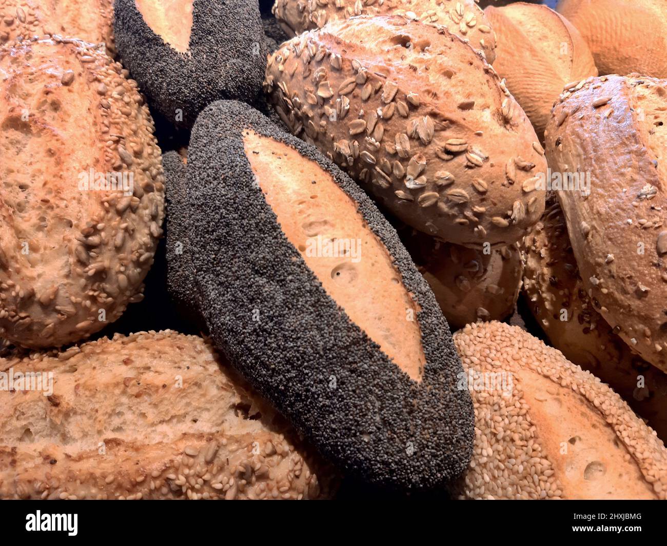 Bread rolls in a bakery display as a symbol for diversity in the range ...