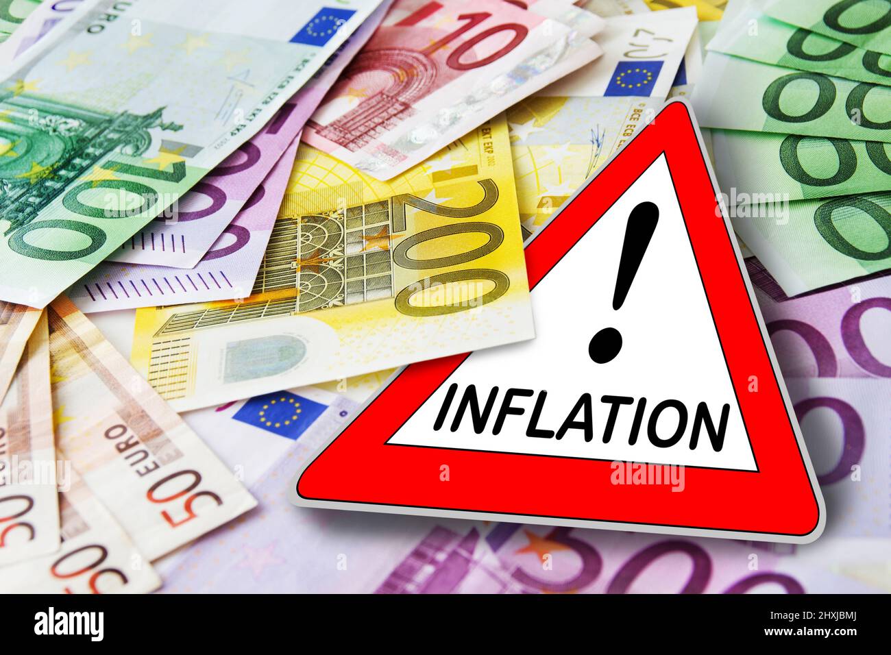 Sign and Inflation with Euro banknotes closeup Stock Photo - Alamy