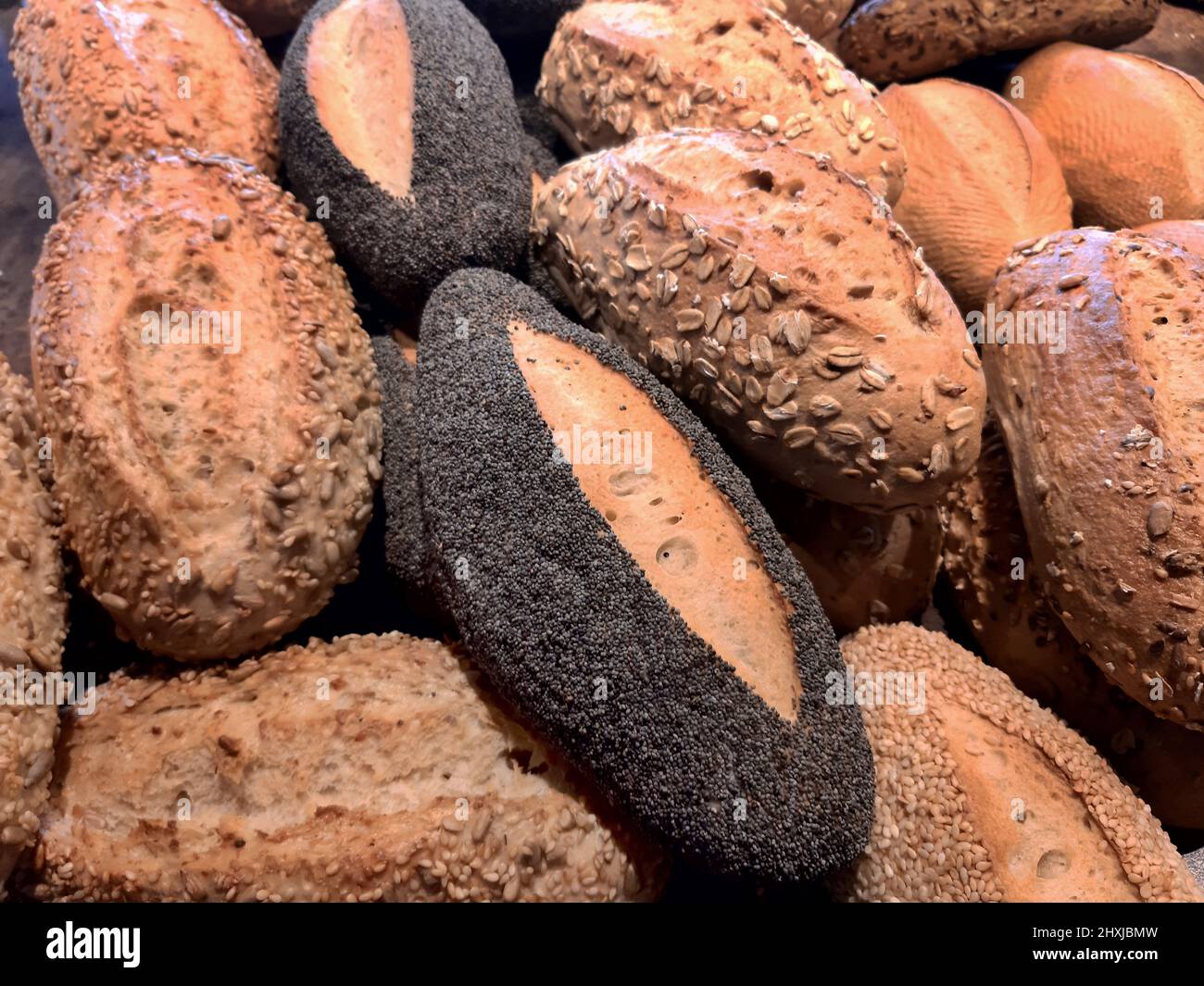 Bread rolls in a bakery display as a symbol for diversity in the range ...
