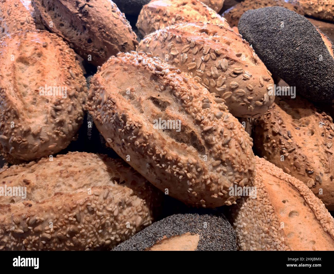 Bread rolls in a bakery display as a symbol for diversity in the range ...