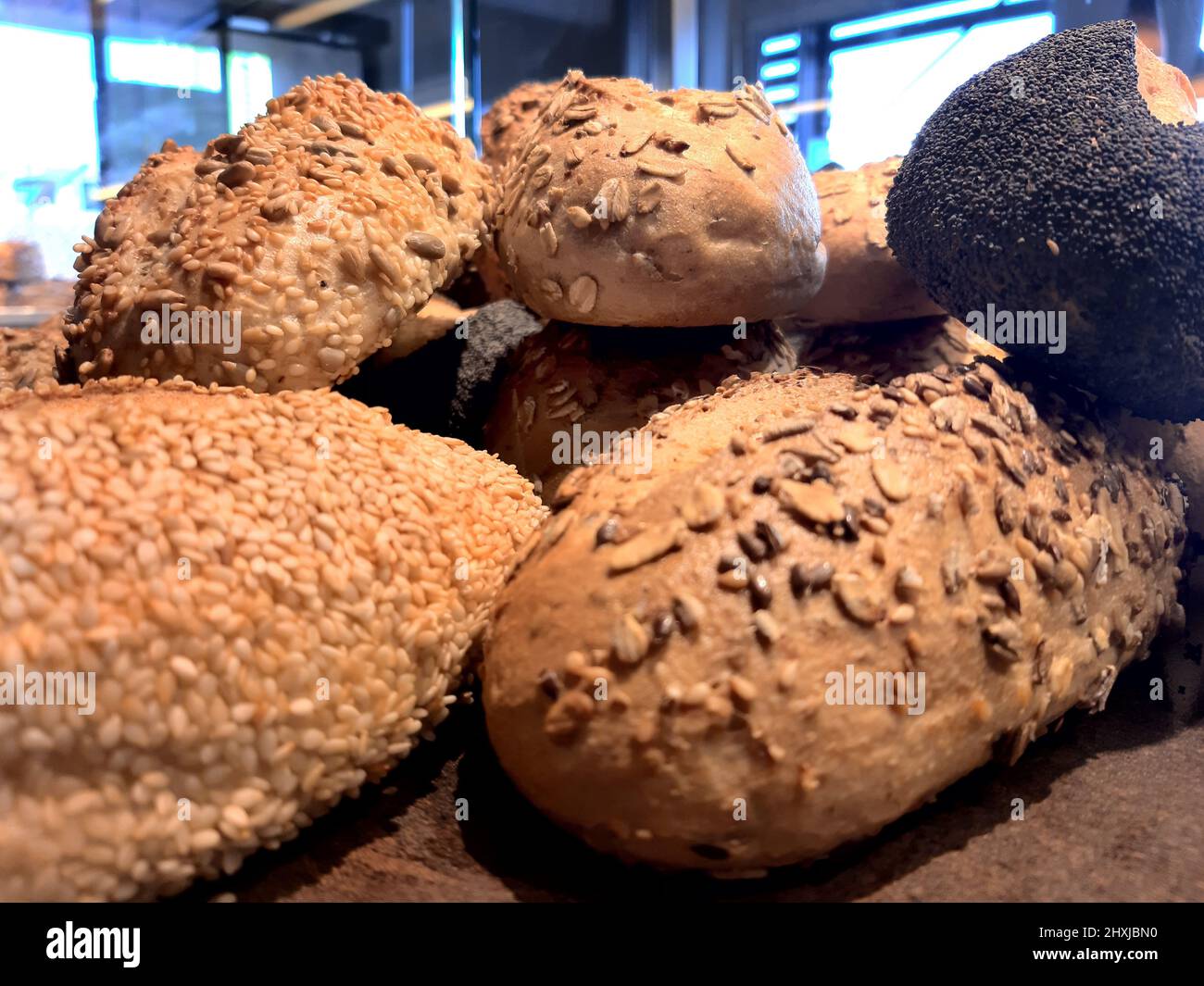 Bread rolls in a bakery display as a symbol for diversity in the range ...