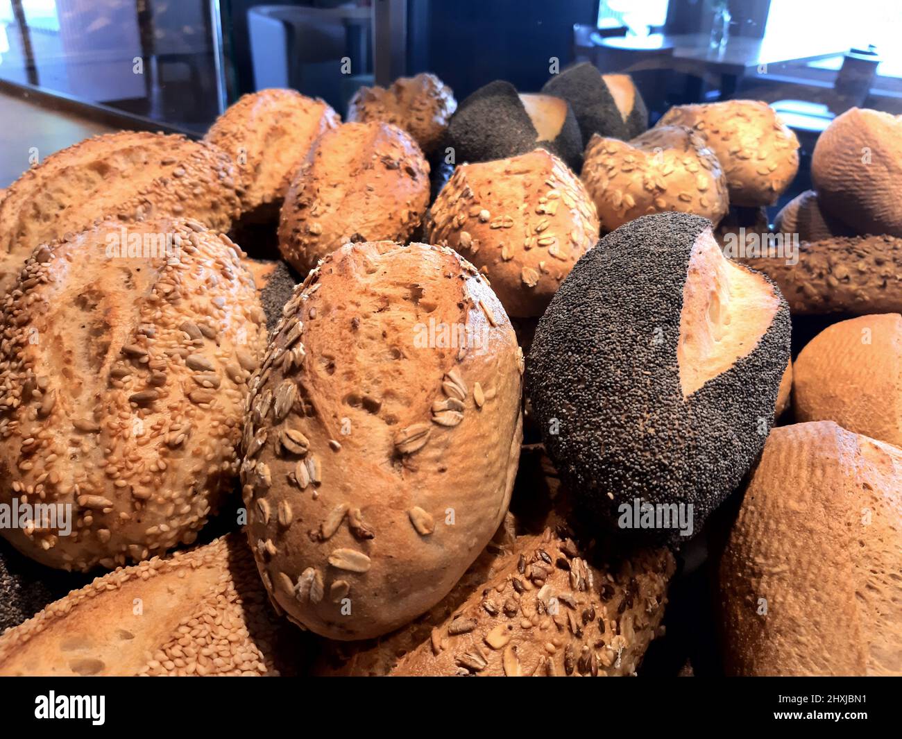 Bread rolls in a bakery display as a symbol for diversity in the range ...