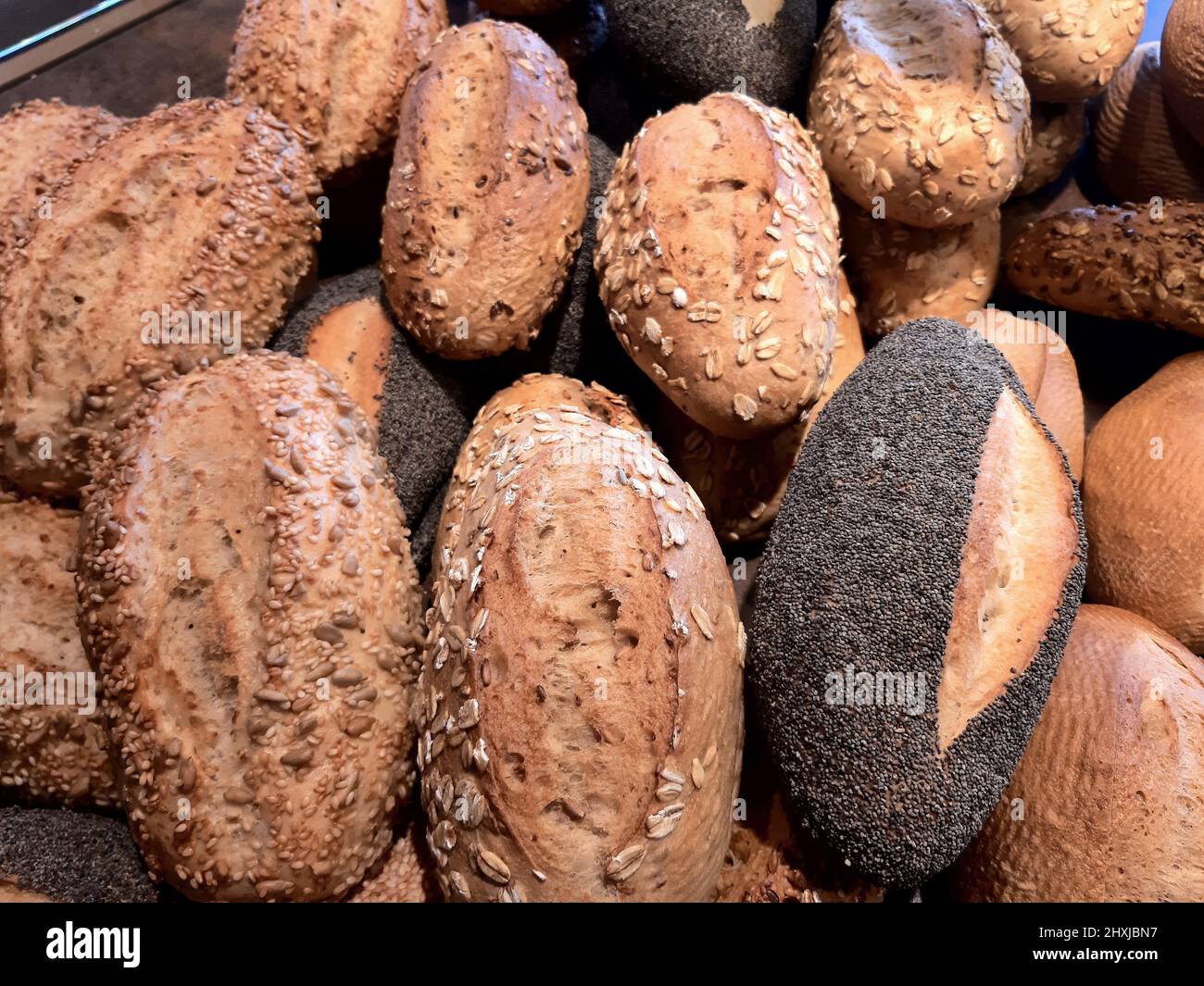 Bread rolls in a bakery display as a symbol for diversity in the range ...