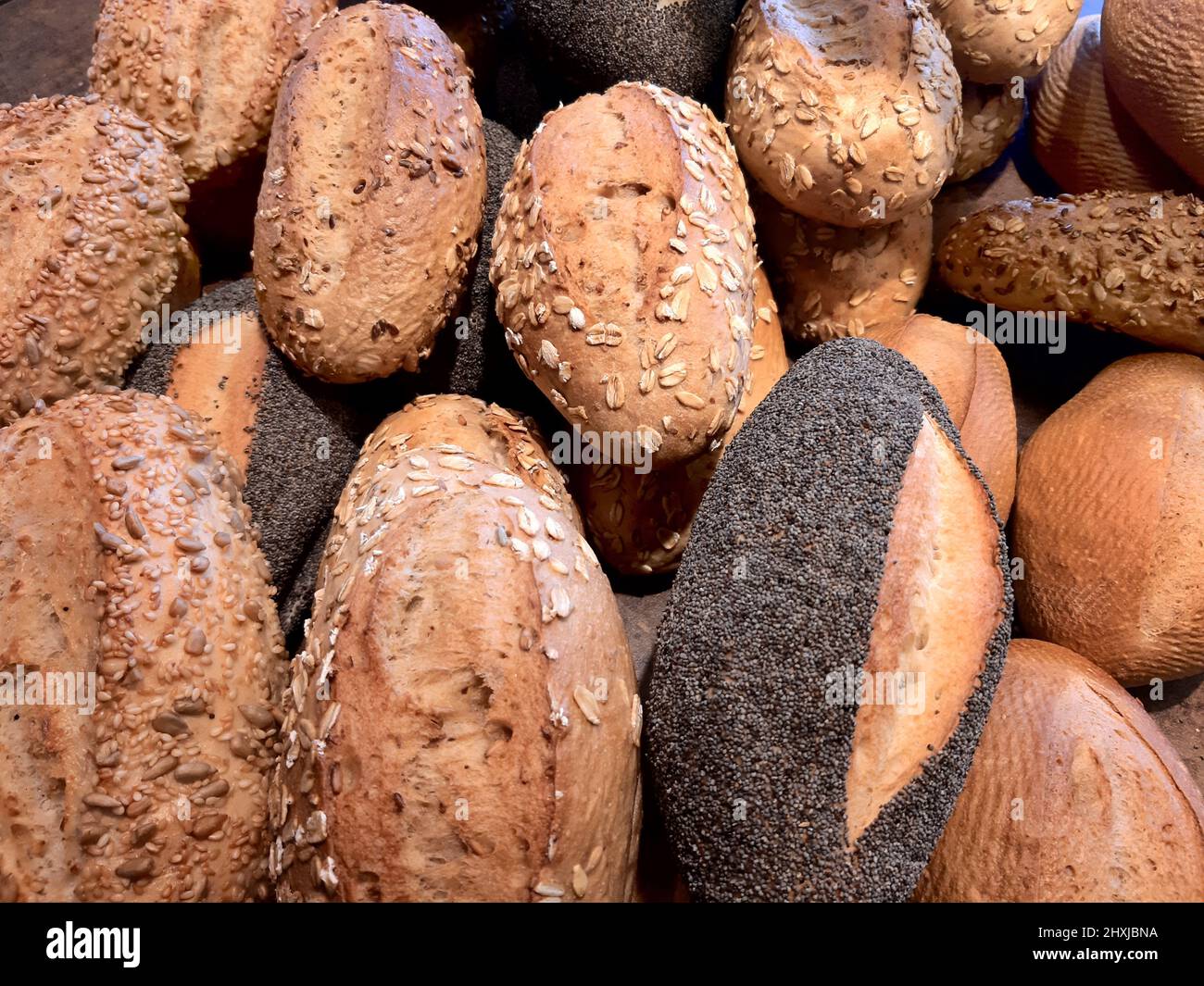 Bread rolls in a bakery display as a symbol for diversity in the range ...