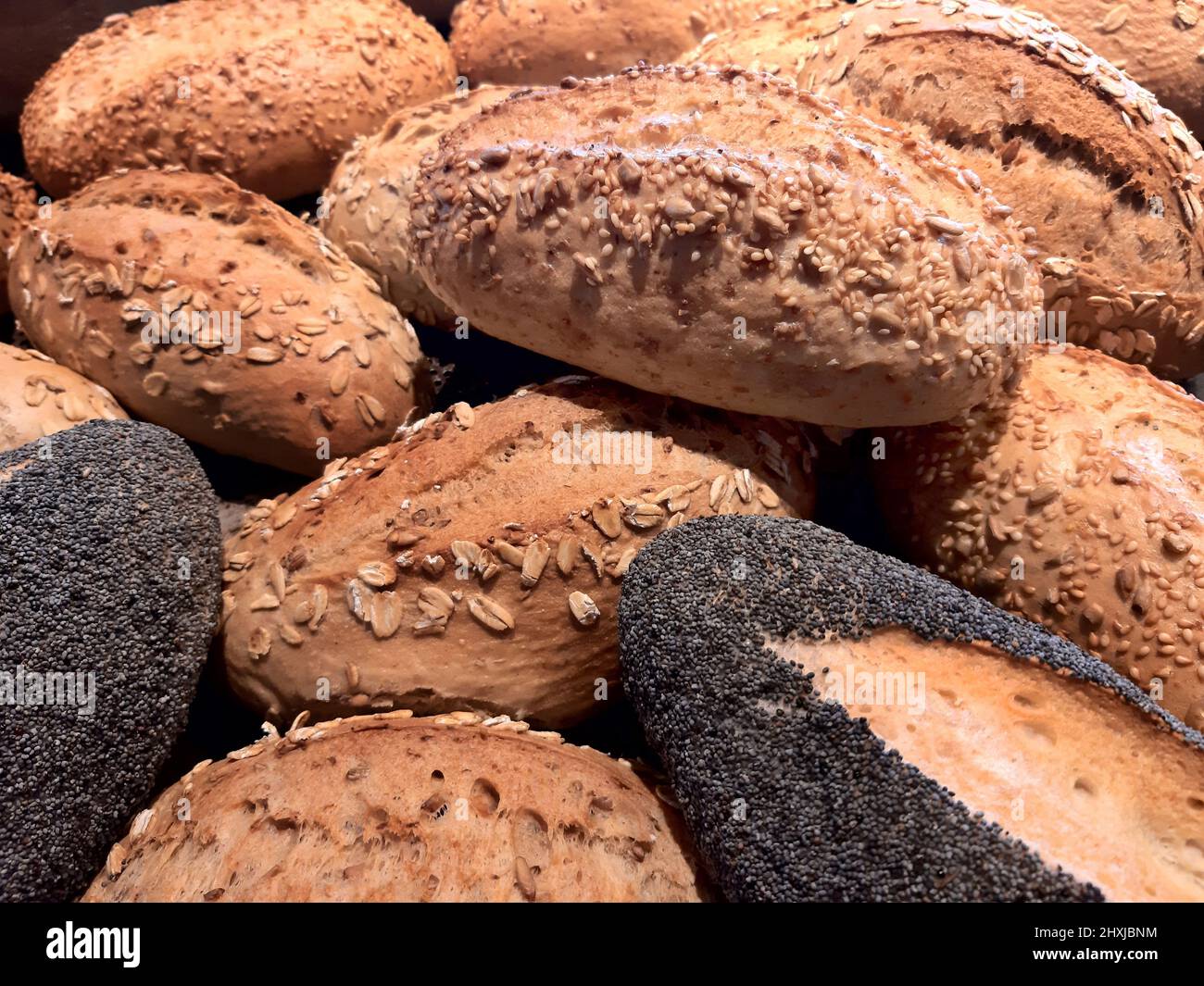 Bread rolls in a bakery display as a symbol for diversity in the range ...