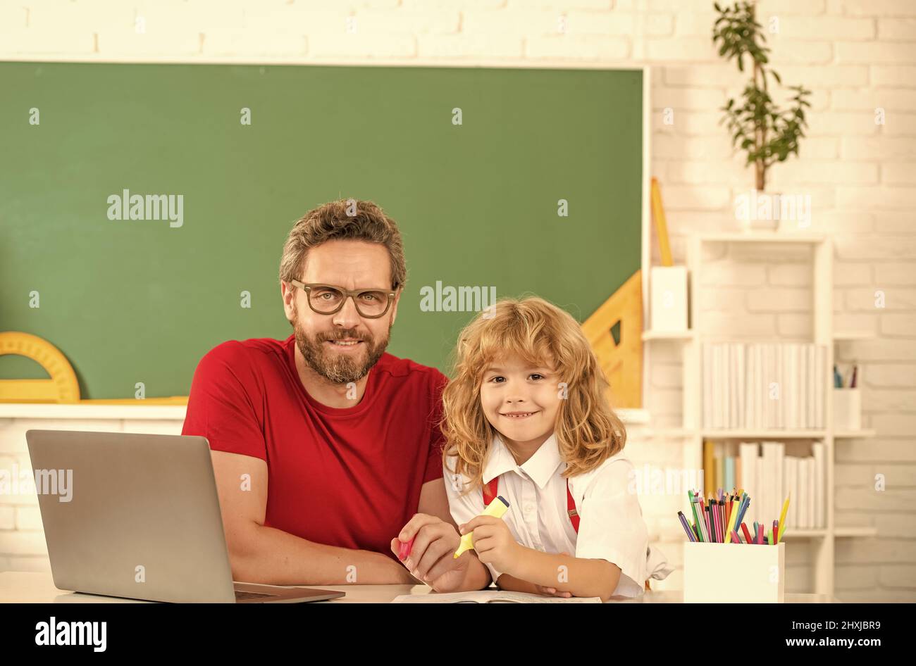 father and kid study in classroom with laptop, knowledge Stock Photo ...