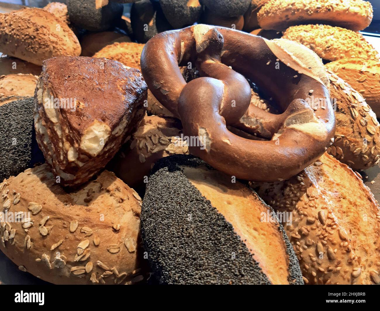 Bread rolls in a bakery display as a symbol for diversity in the range ...