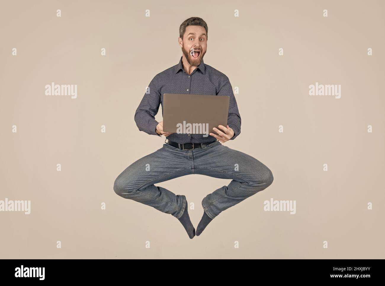 jumping businessman working online. success. programmer man use pc Stock Photo - Alamy