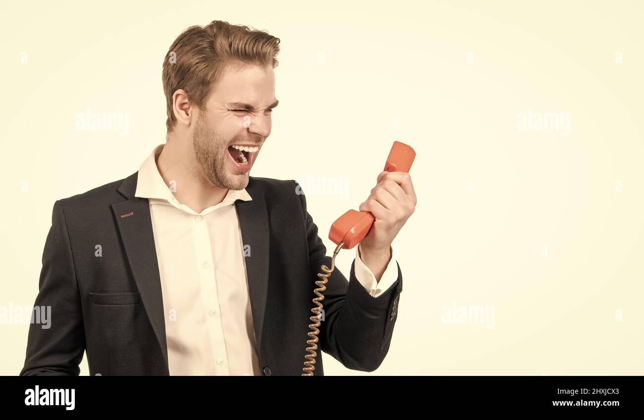 Bad line. Angry manager scream holding telephone receiver. Screaming ...