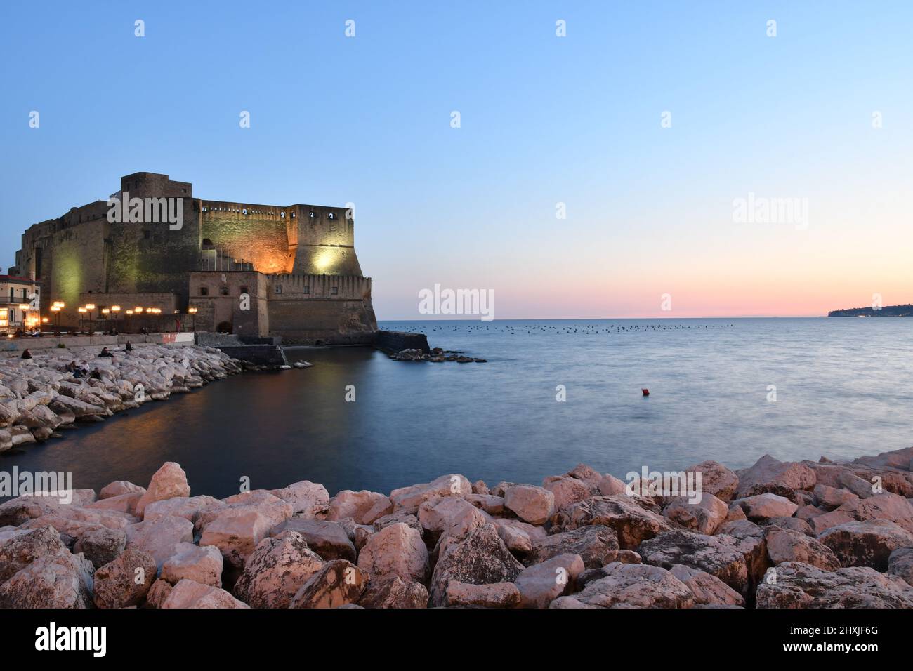 Sunset over the bay of the city of Naples in Italy. You can see the ...