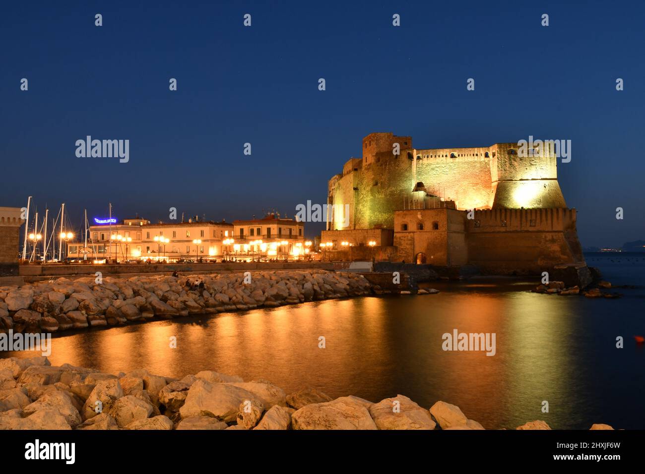 Night photo of Castel dell'Ovo, a castle on sea in the city of Naples ...