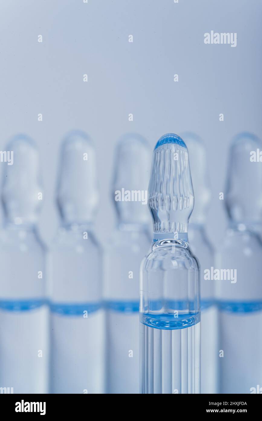 Glass medical ampoule vial for injection. Medicine is liquid sodium ...