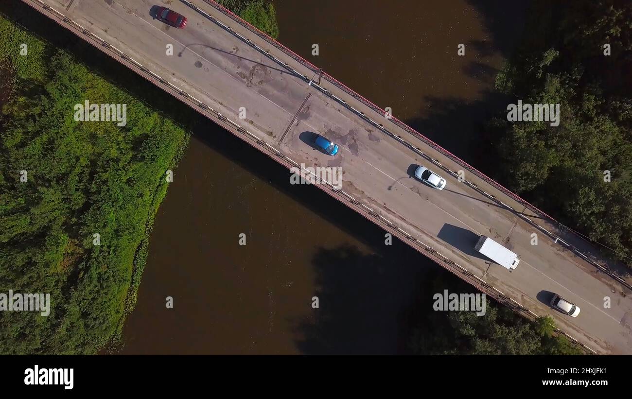 A small bridge over the river. Clip. The view from the drone. A narrow ...