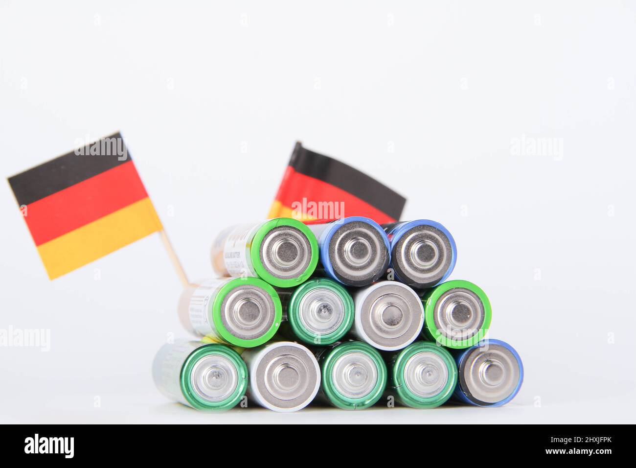 Battery. A lot of batteries on the background of the flag of the ...