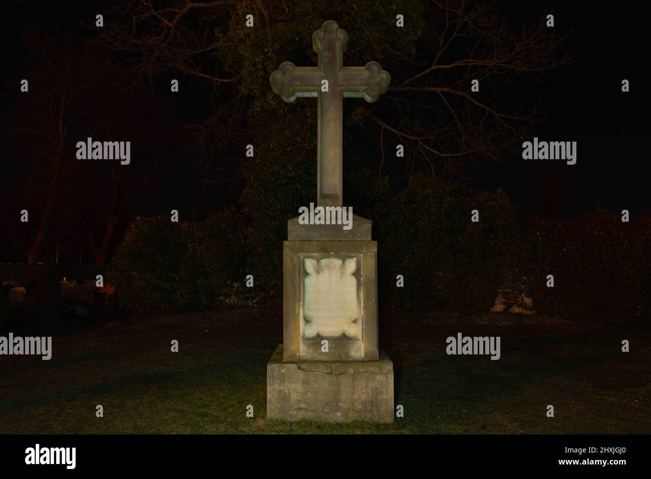 The darkness of the night in the cemetery, among which you can see a ...