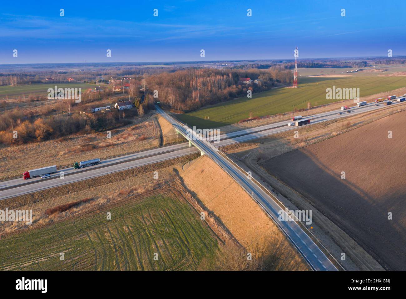 A vast plain, arable fields and meadows, in the center of the frame you ...