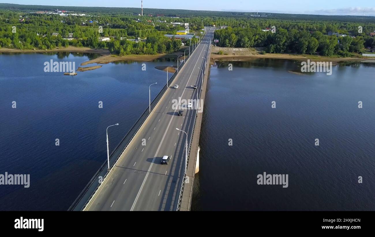 View from the height . Clip. A large long bridge over the river on ...