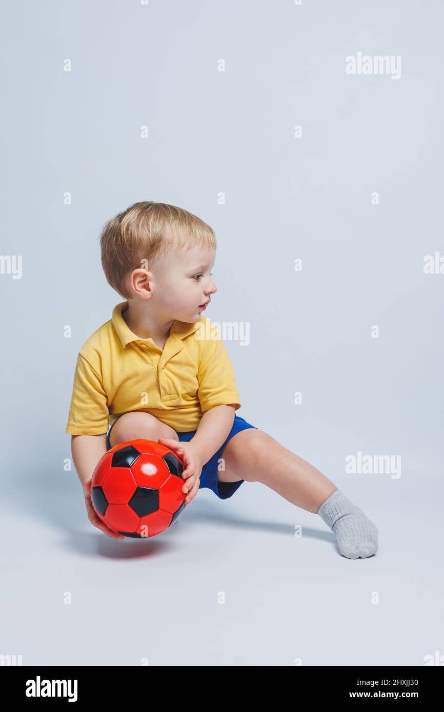 Little cute kid baby boy 3-4 years old, football fan in red t-shirt ...