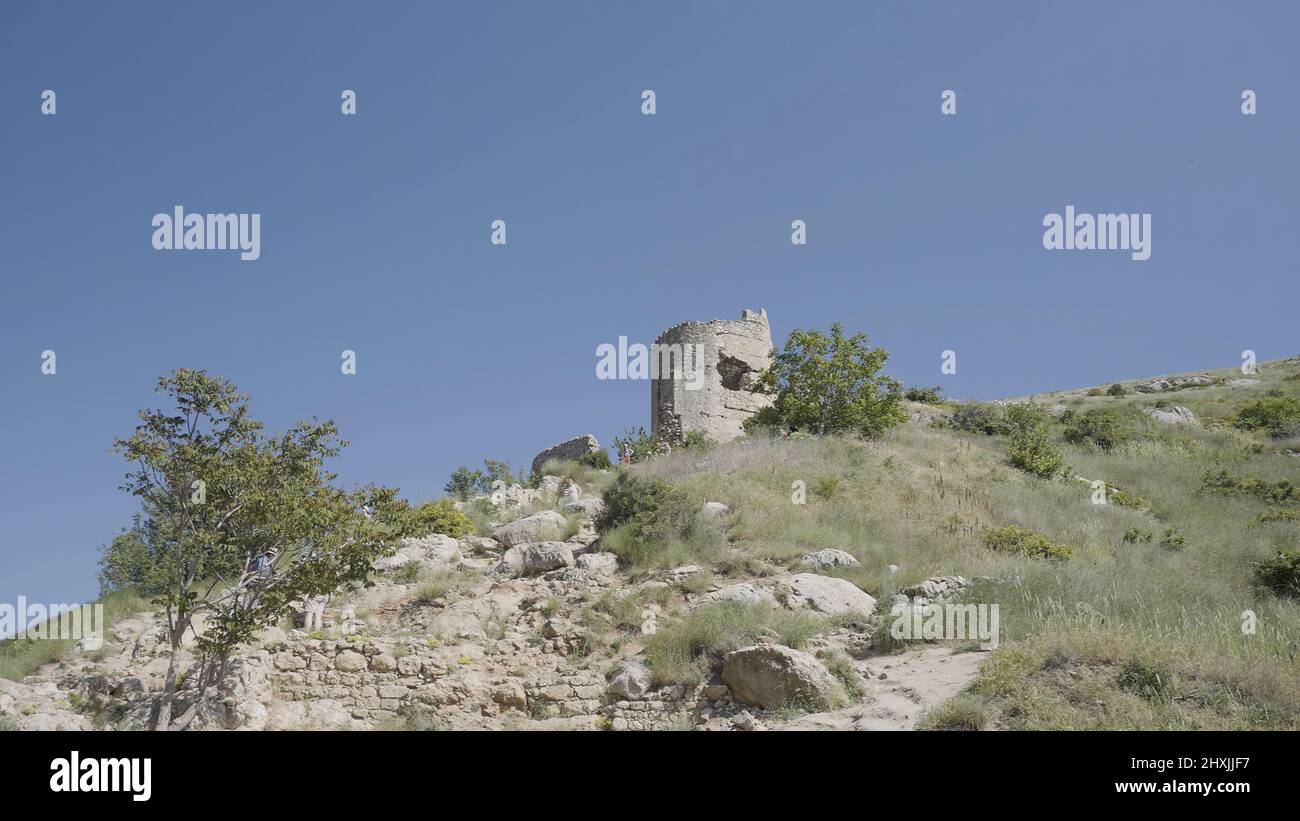 Ancient ruined castle on the top of the hill on blue clear sky ...