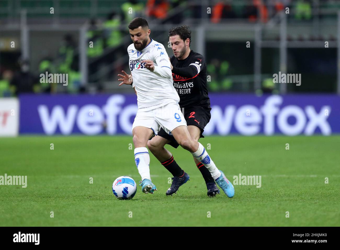 Davide Calabria of Ac Milan and Patrick Cutrone of Empoli Fc battle for ...