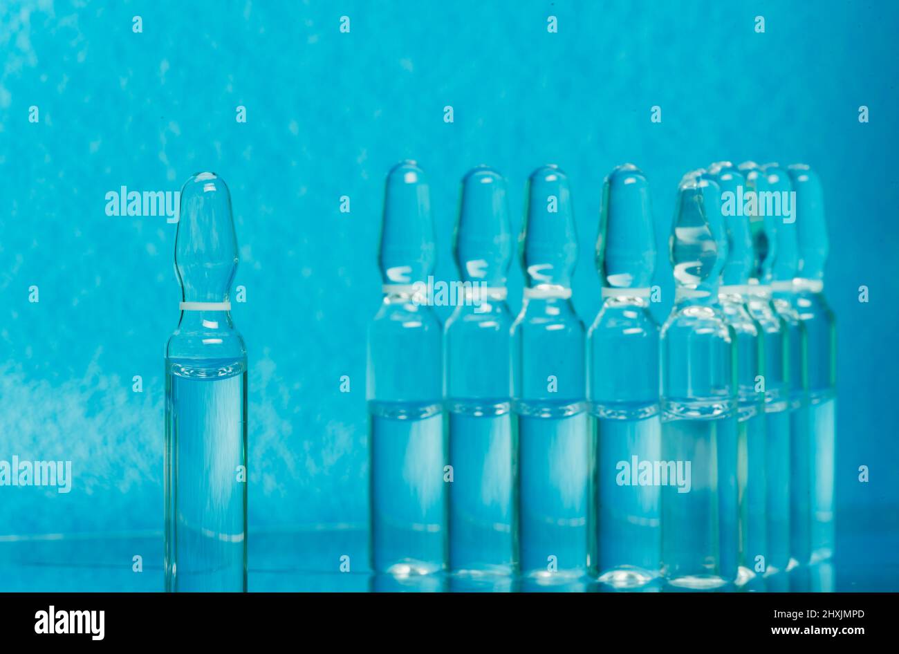 Glass medical ampoule vial for injection. Medicine is liquid sodium ...