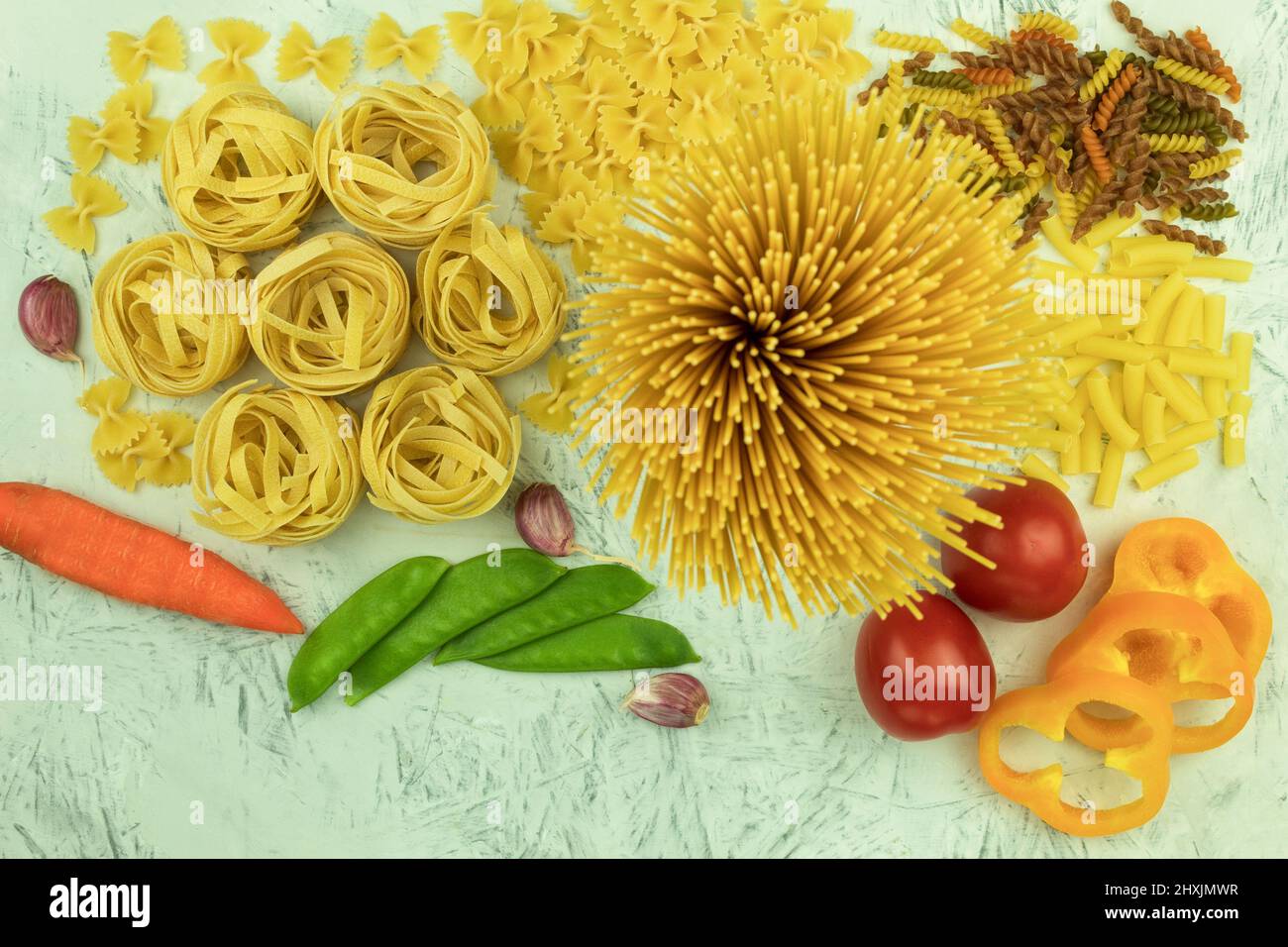 Assorted different types of pasta on the table. Various types of raw ...